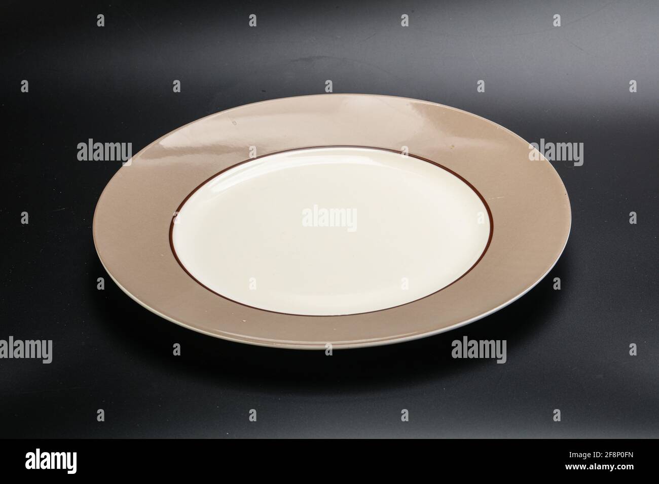 Empty color plate for kitchen isolated Stock Photo - Alamy