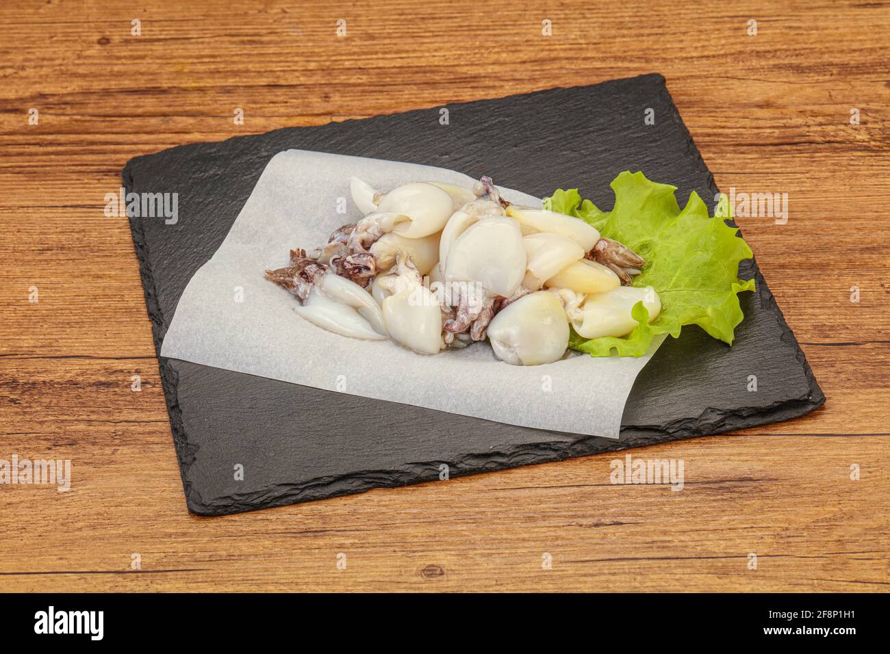 Raw seafood - cuttlefish for cooking over board Stock Photo - Alamy