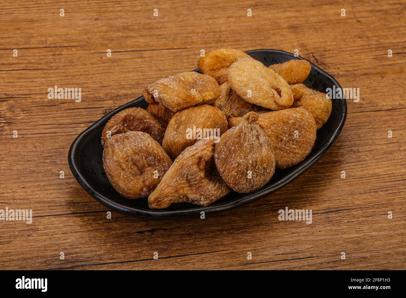 Dry sweet fig fruit heap snack Stock Photo - Alamy