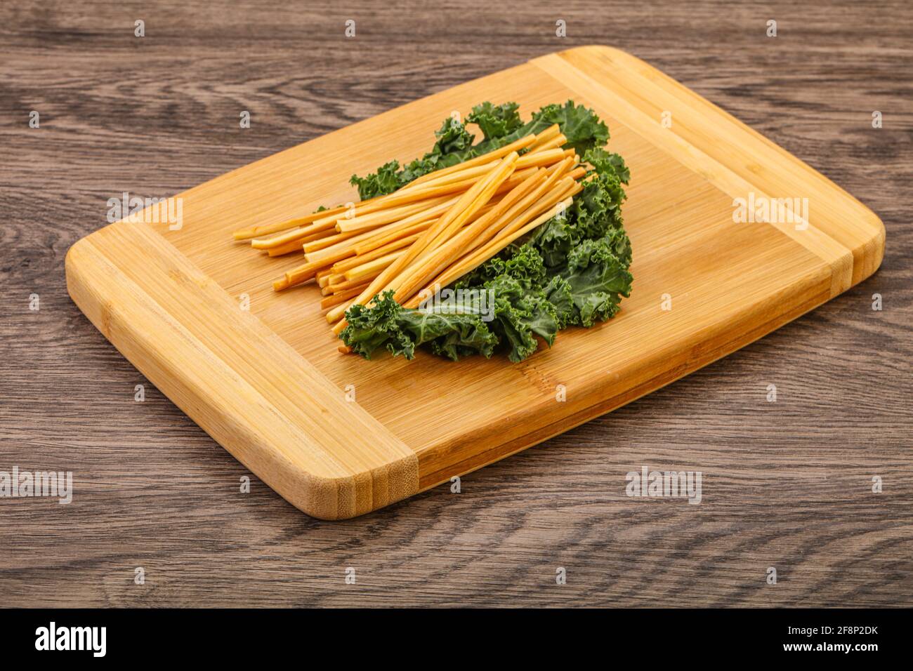 Caucasian Chechel cheese sticks over board Stock Photo - Alamy