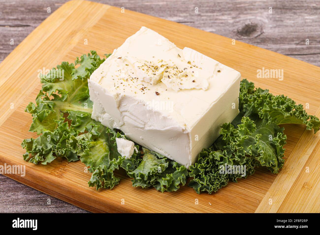 Traditional tasty Greek Feta soft cheese brick Stock Photo - Alamy