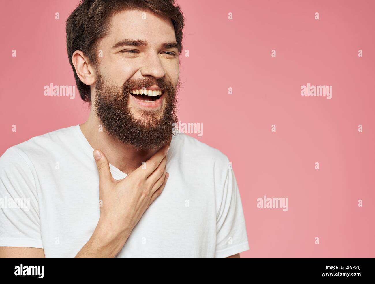 Puzzled man gesturing with hands side view pink background Stock Photo ...