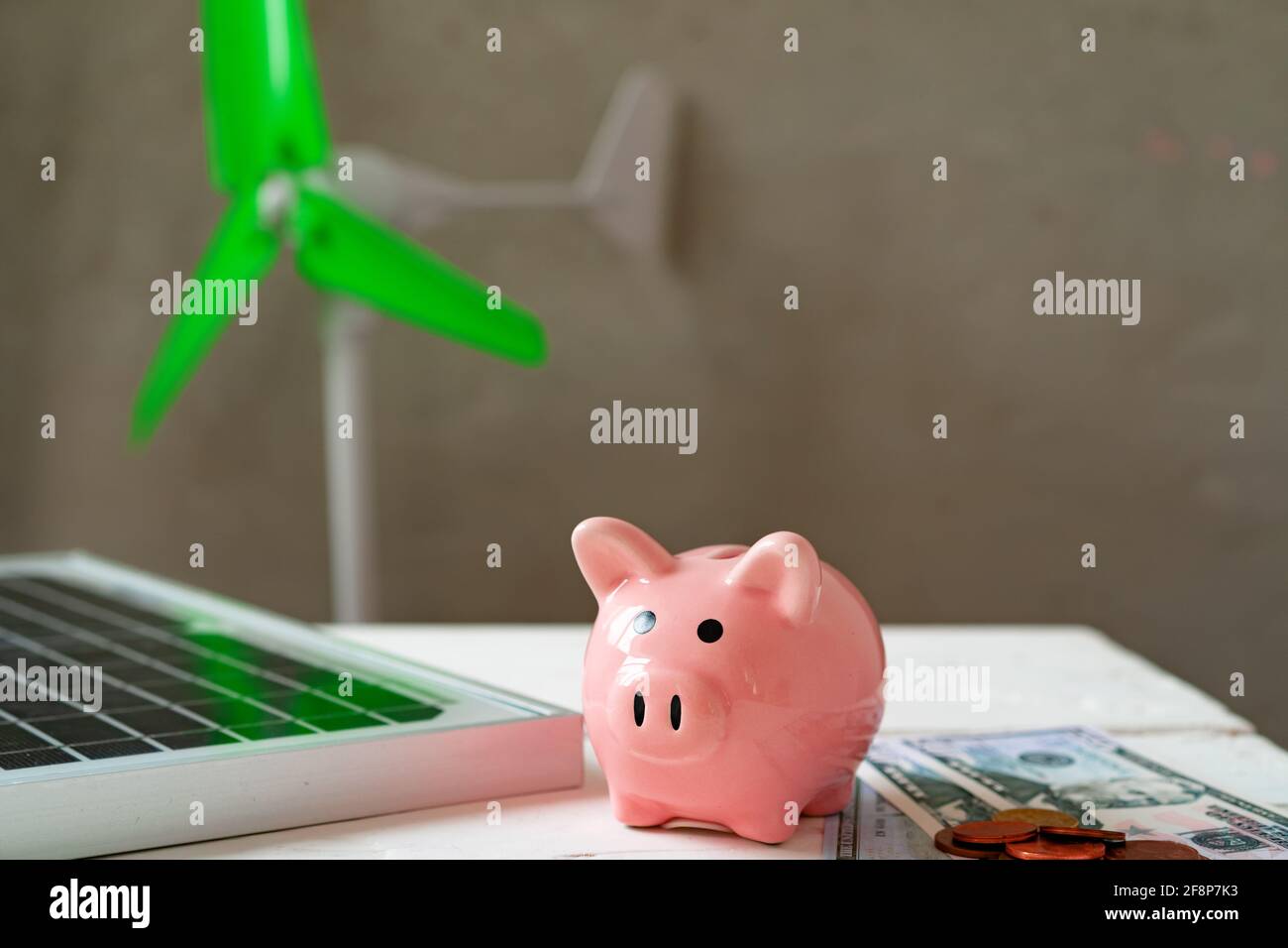 Models of windmill and solar panel, alternative energy sources Stock ...