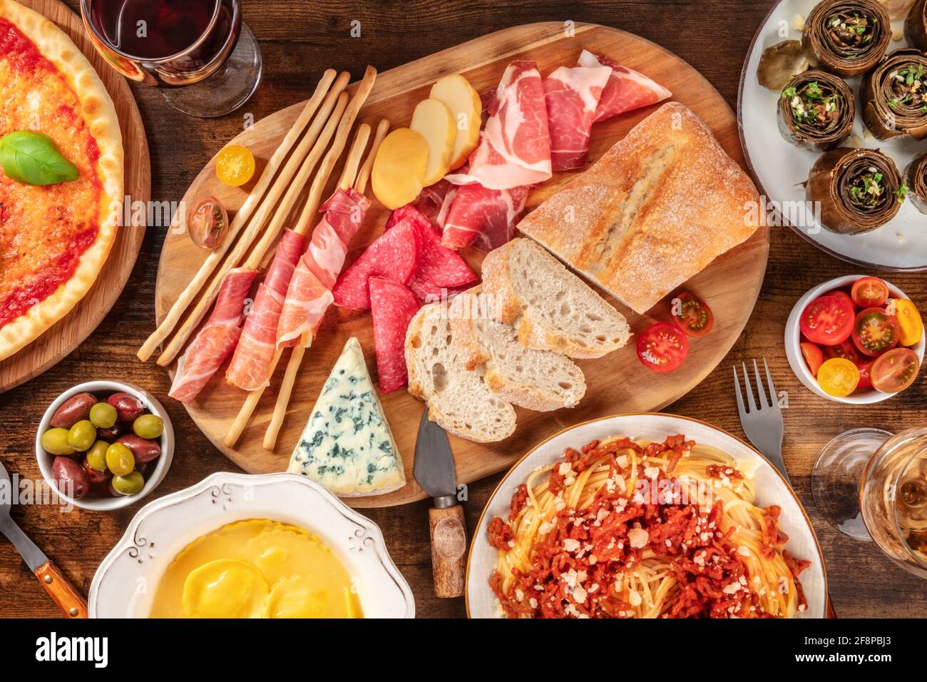 Italian food, shot from above. Many different dishes of Italian cuisine ...