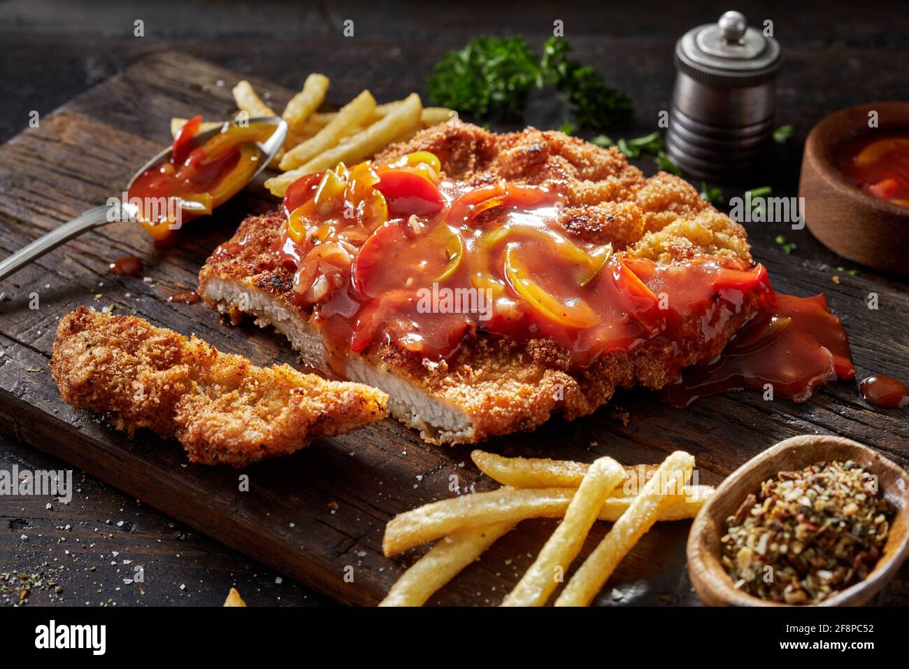 Closeup of delicious fried breaded meat Gypsy Schnitzel with spicy ...