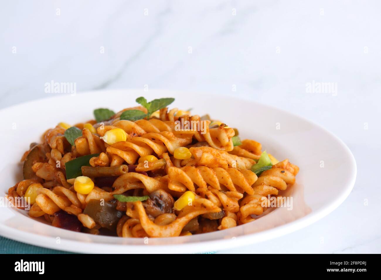 Whole wheat fusilli Pasta Arrabbiata with vegetables. Vegetable Pasta ...