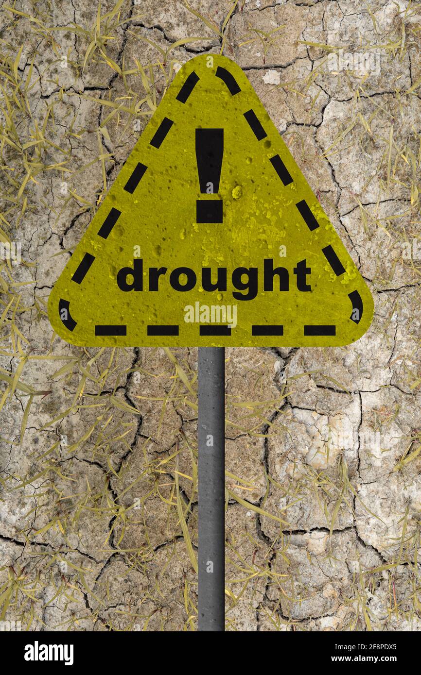 yellow drought hazard sign on cracked dry ground background Stock Photo ...