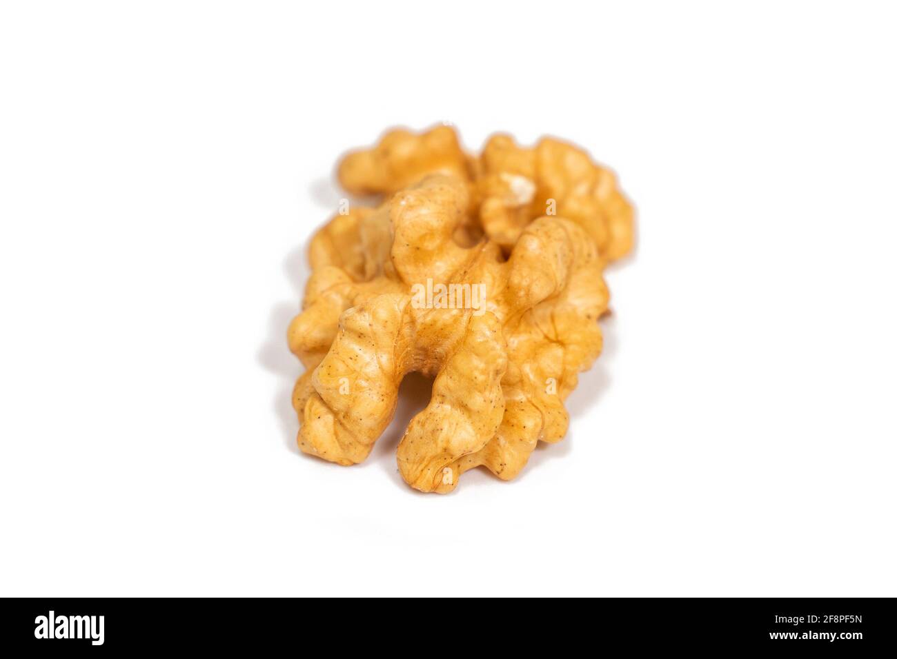 Single walnut kernel isolated on white background. Top view Stock Photo ...