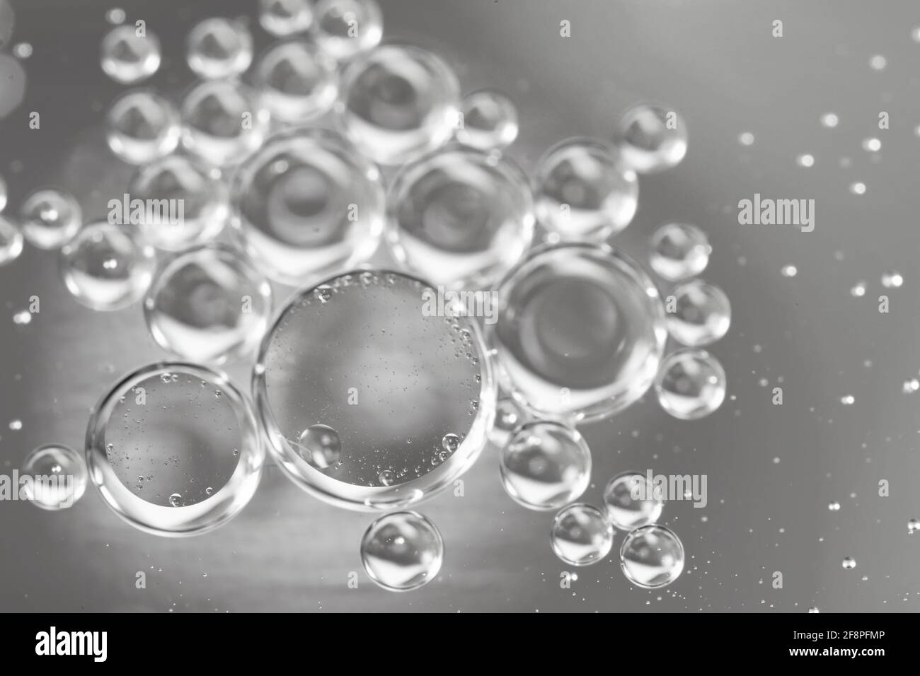 Colorful bubbles from oil in water in a macro shot Stock Photo - Alamy