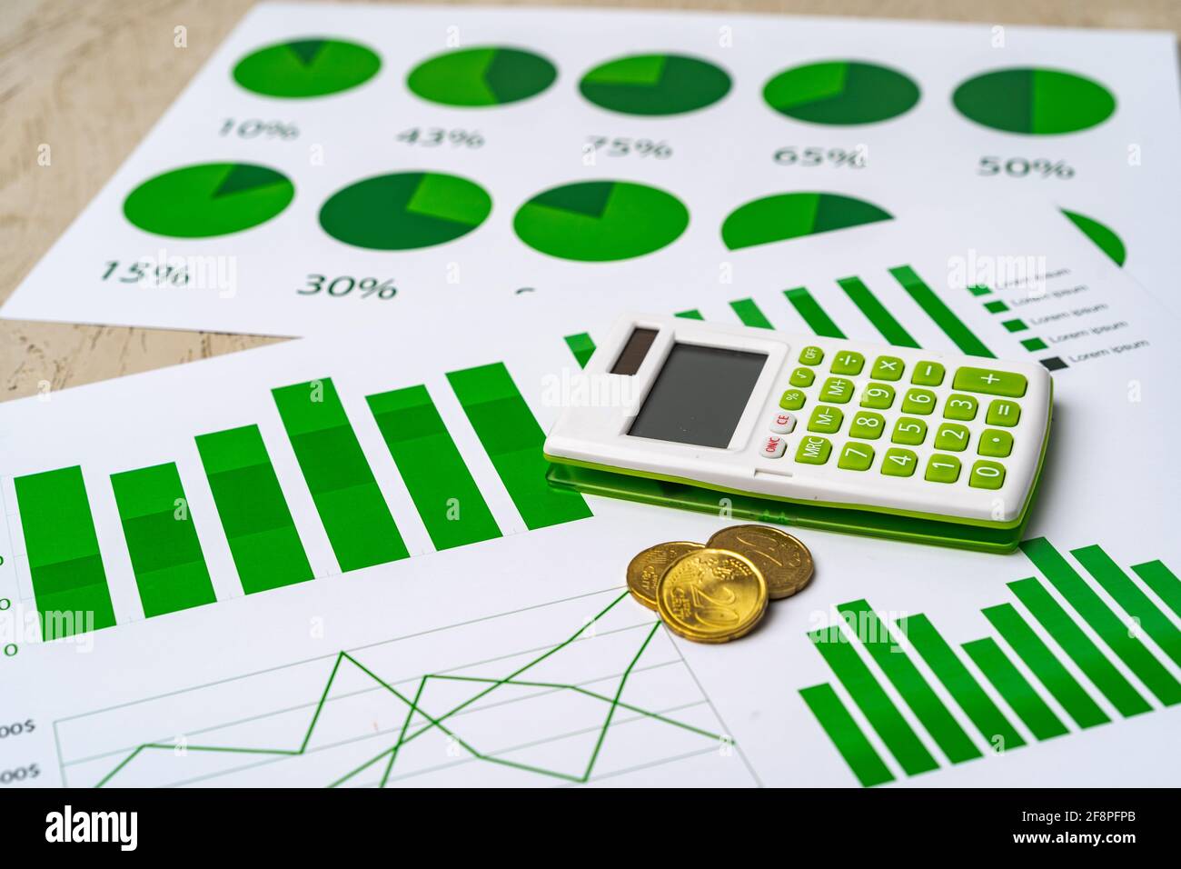Financial paper with charts and diagrams on gray table Stock Photo - Alamy