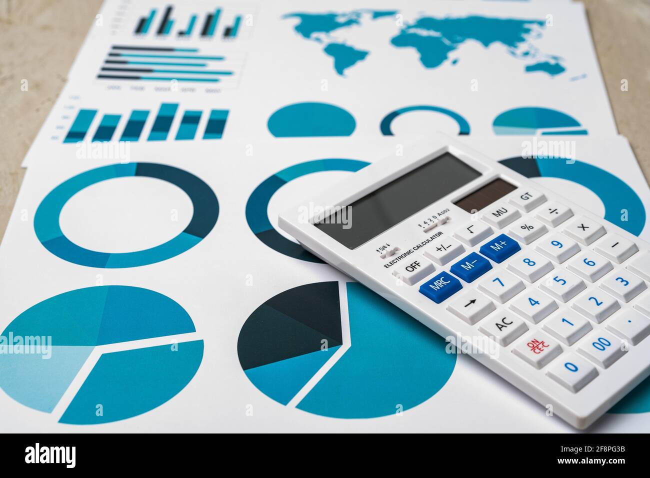 Financial paper with charts and diagrams on gray table Stock Photo - Alamy