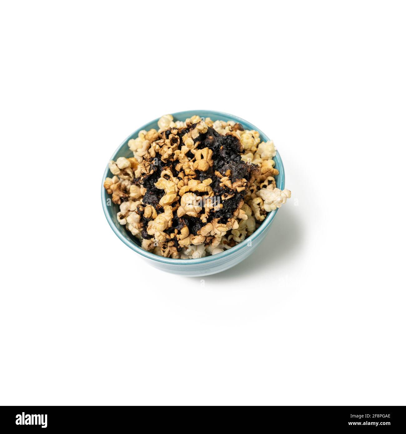 Burnt popcorn kernel , isolate on white background Stock Photo - Alamy