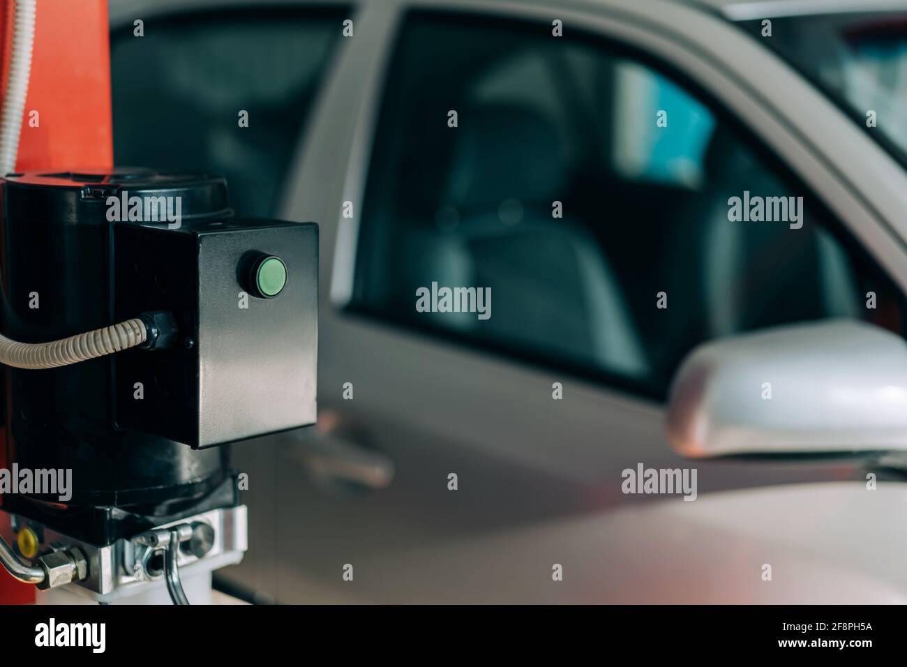 Car lift standing at the service station. Car repair equipment Stock ...