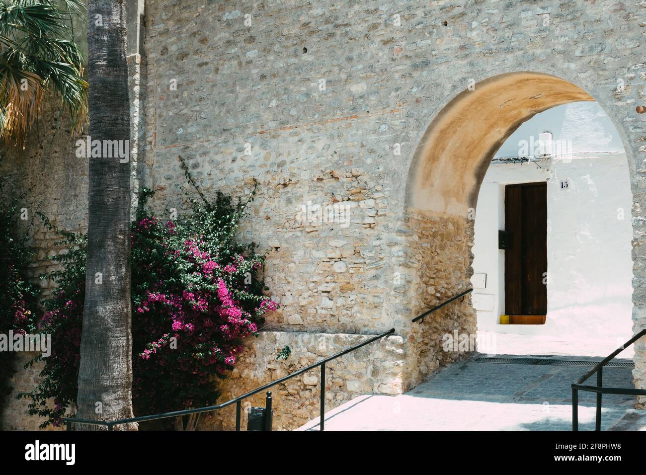 Stone arch with a small footbridge in Vejer de la Frontera, Spain Stock ...