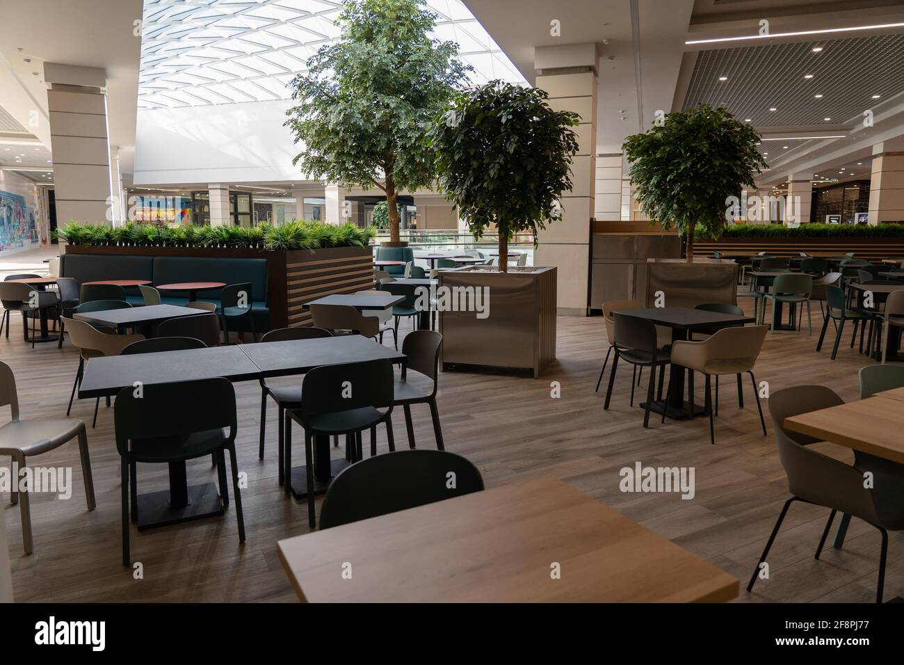 Interior of wooden table in food court shopping mall. Food center in ...