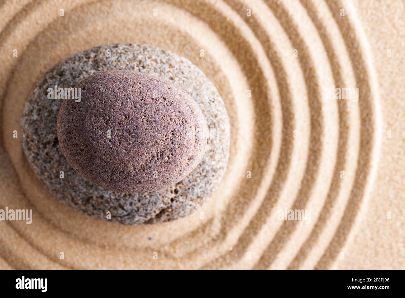 Japanese zen garden with stone in raked sand Stock Photo - Alamy