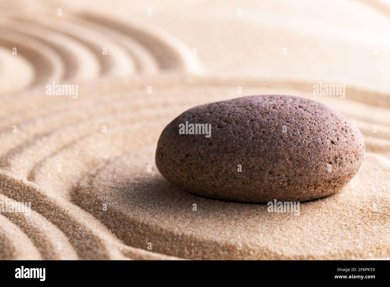 Japanese zen garden with stone in raked sand Stock Photo - Alamy