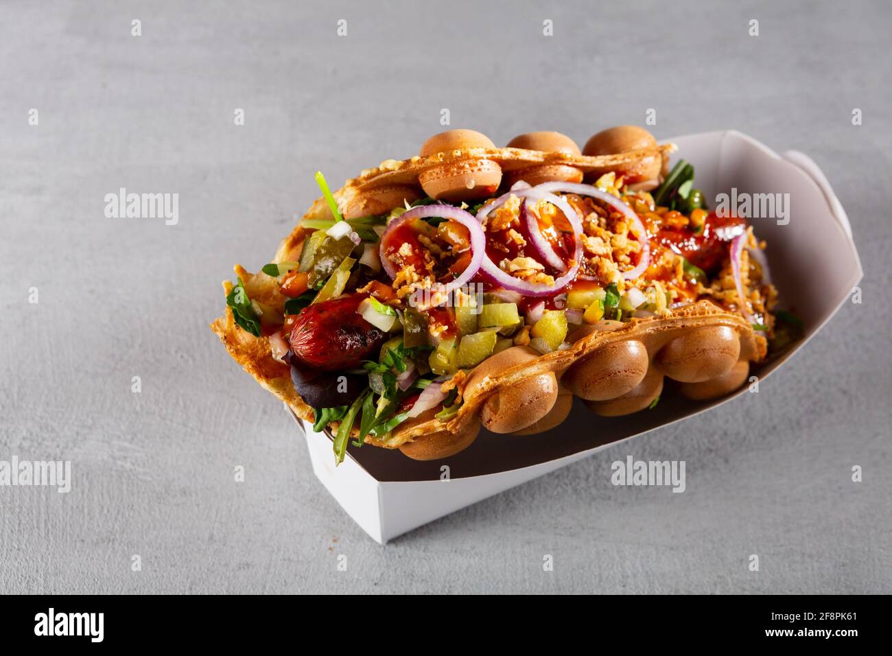 Street food waffle with sausage and salad on paper plate Stock Photo ...