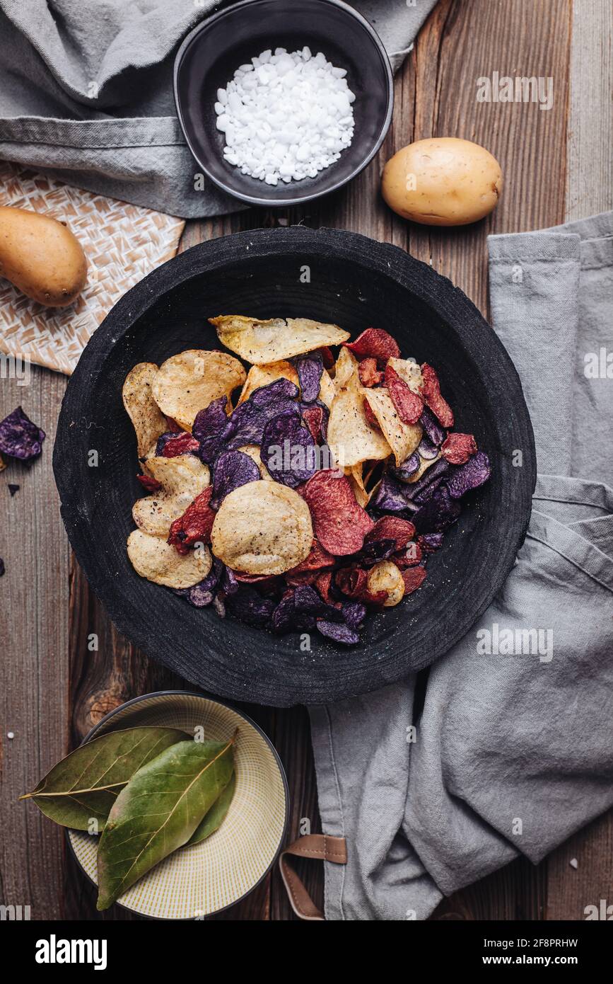 Crispy potato chips in various colors Stock Photo - Alamy
