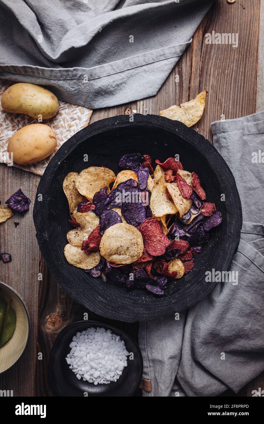 Crispy potato chips in various colors Stock Photo - Alamy