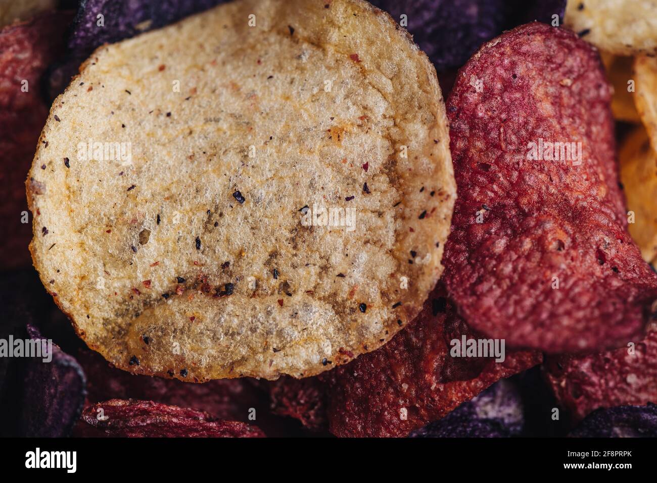Crispy potato chips in various colors Stock Photo - Alamy