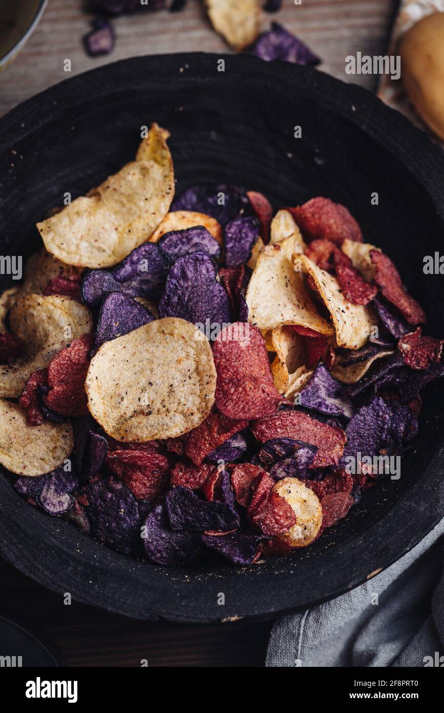 Crispy potato chips in various colors Stock Photo - Alamy