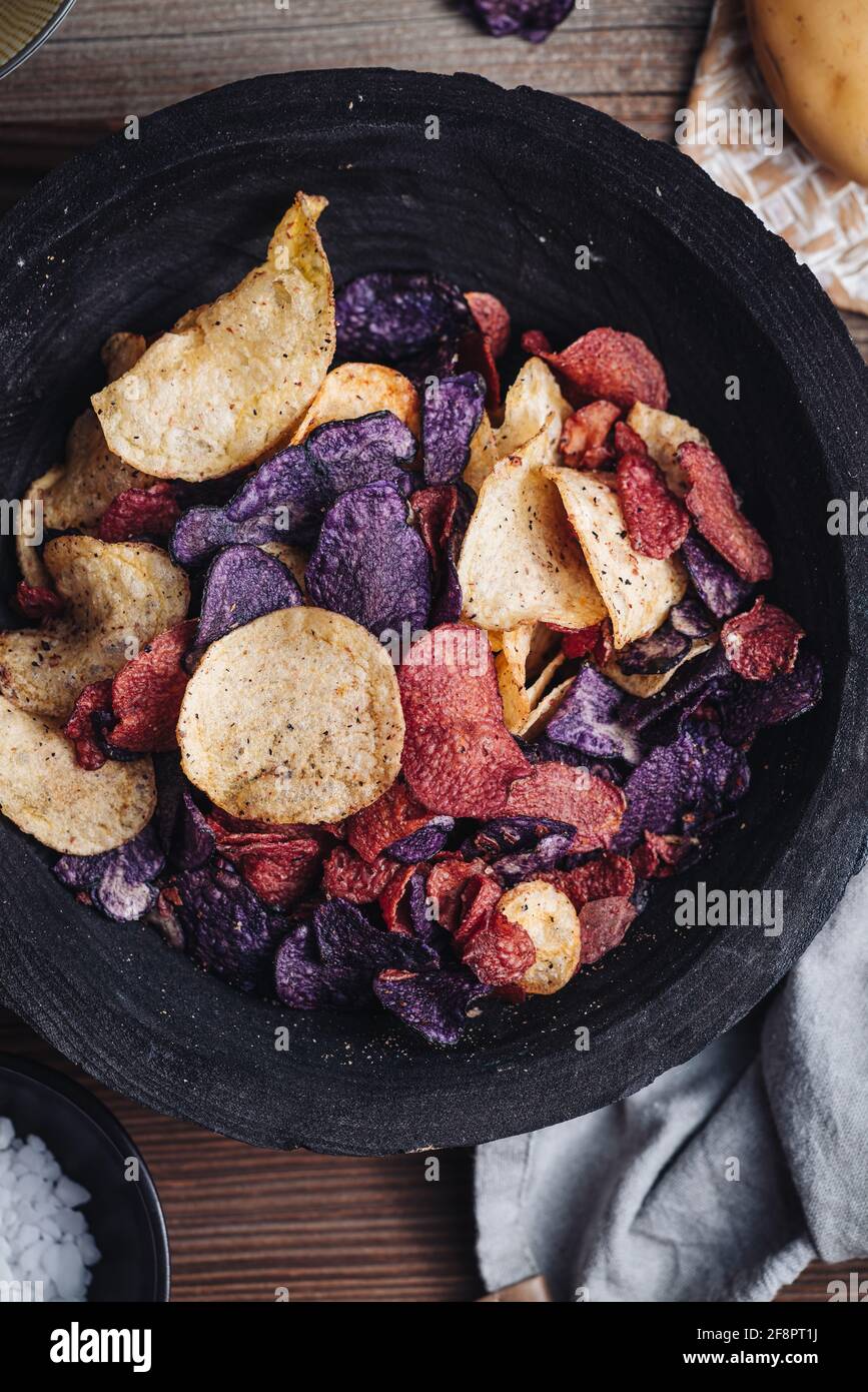Crispy potato chips in various colors Stock Photo - Alamy