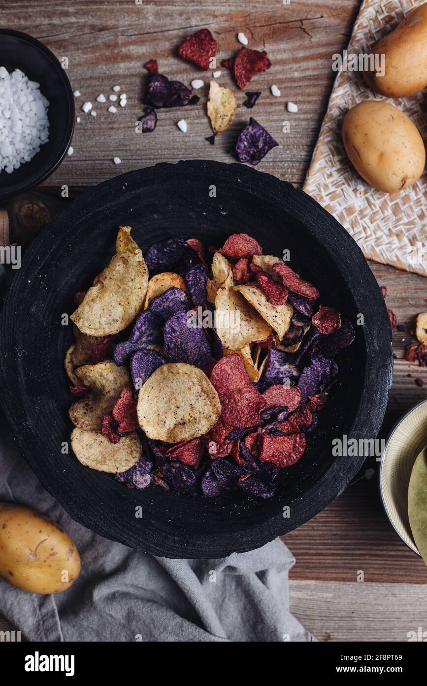 Crispy potato chips in various colors Stock Photo - Alamy