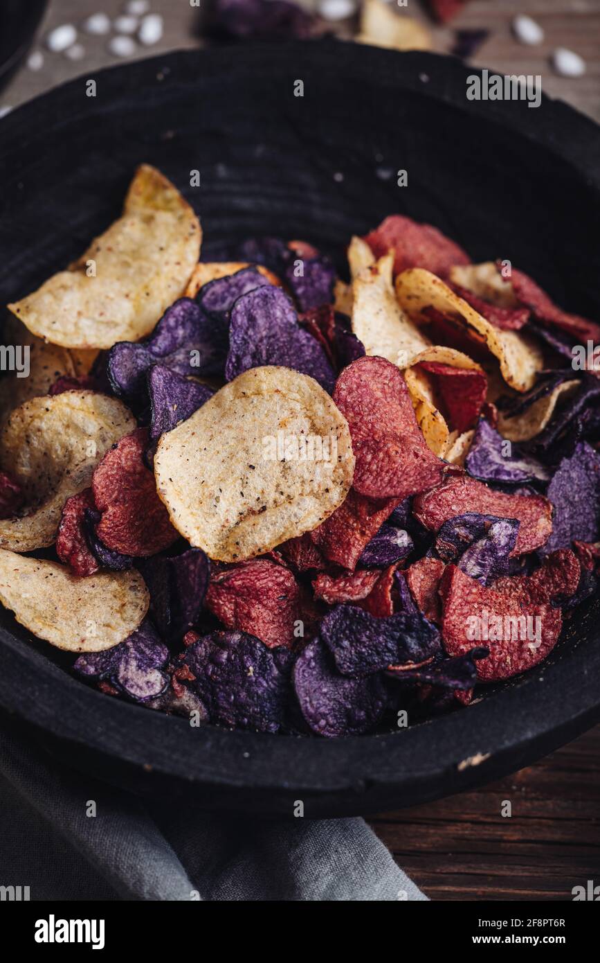 Crispy potato chips in various colors Stock Photo - Alamy