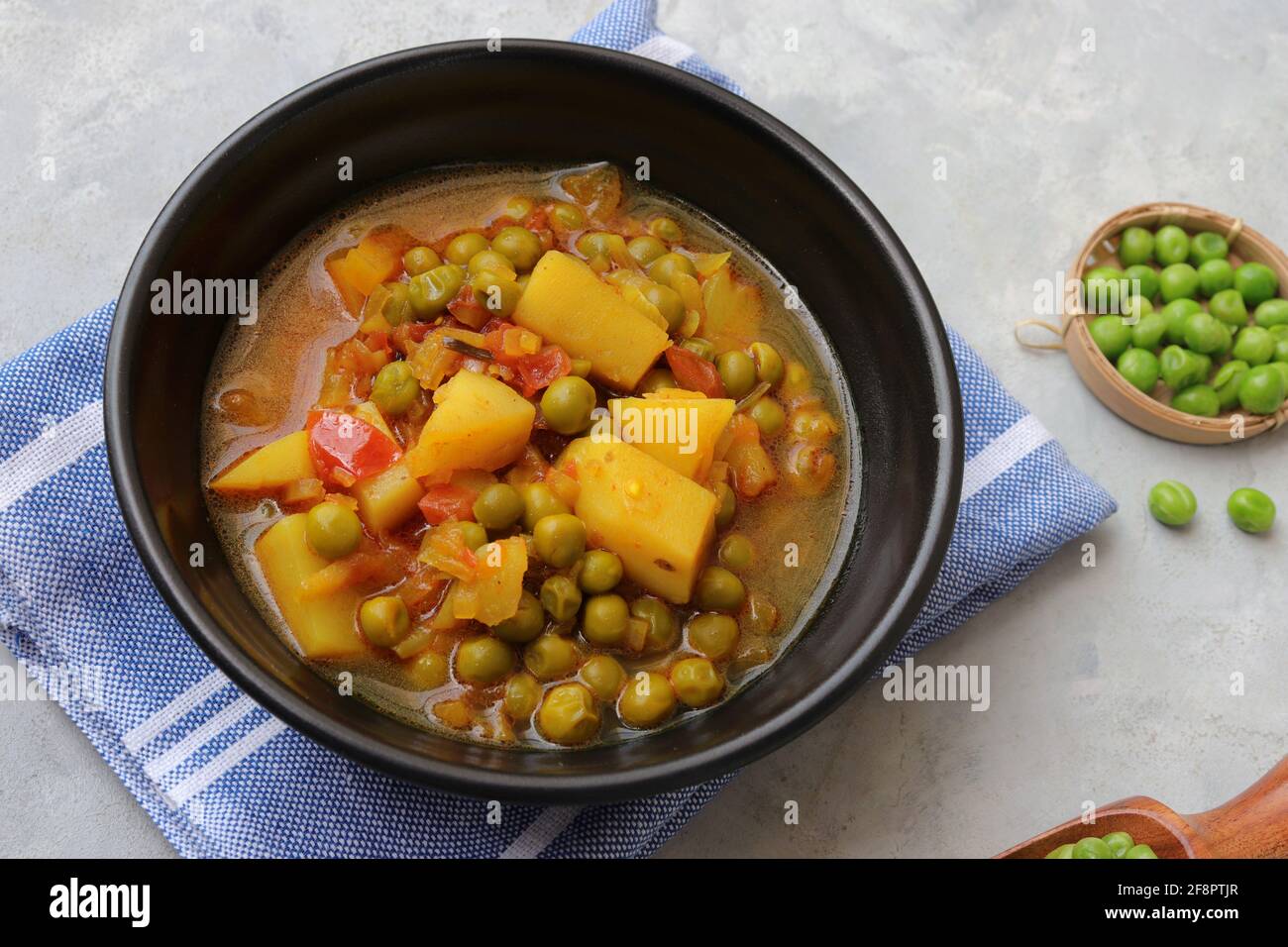 Indian popular homemade Aloo Matar. Potatoes and peas curry. Vatana ...