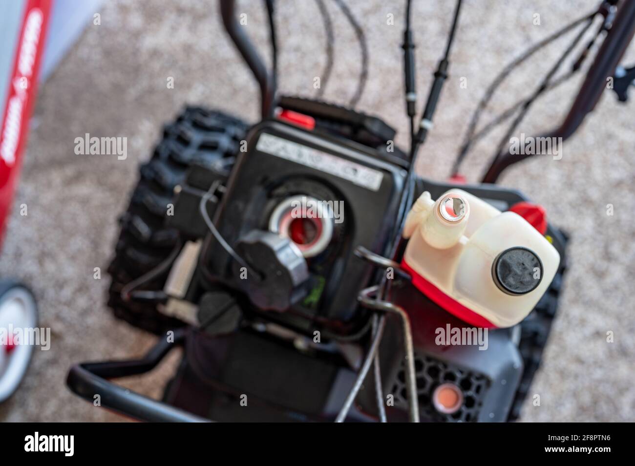 Open gas tank with stabilizer fuel additive being put in before storage ...