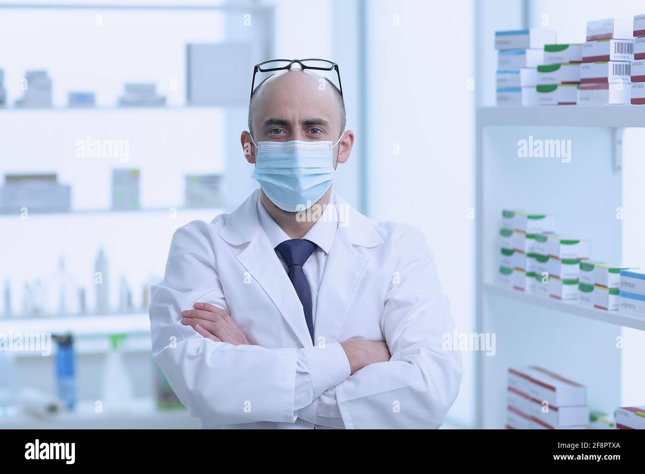 Pharmacist is Working in protective mask. Man Wearing Special Medical ...