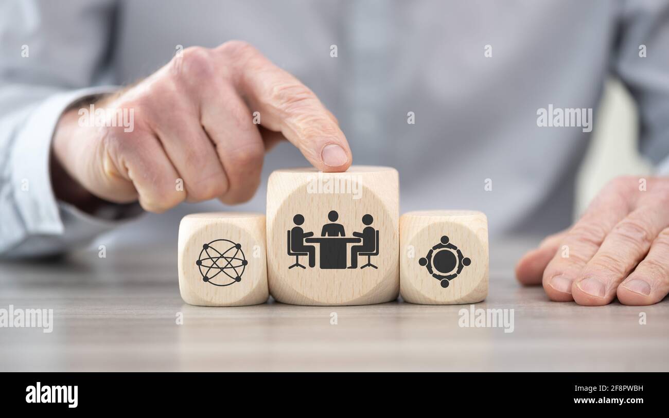 Wooden blocks with symbol of meeting concept Stock Photo - Alamy