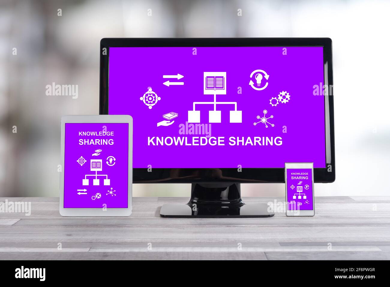 Knowledge sharing concept shown on different information technology ...