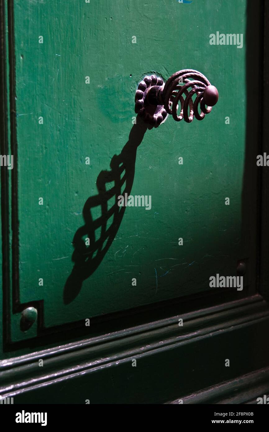 Solid wooden door with brass handle Stock Photo - Alamy