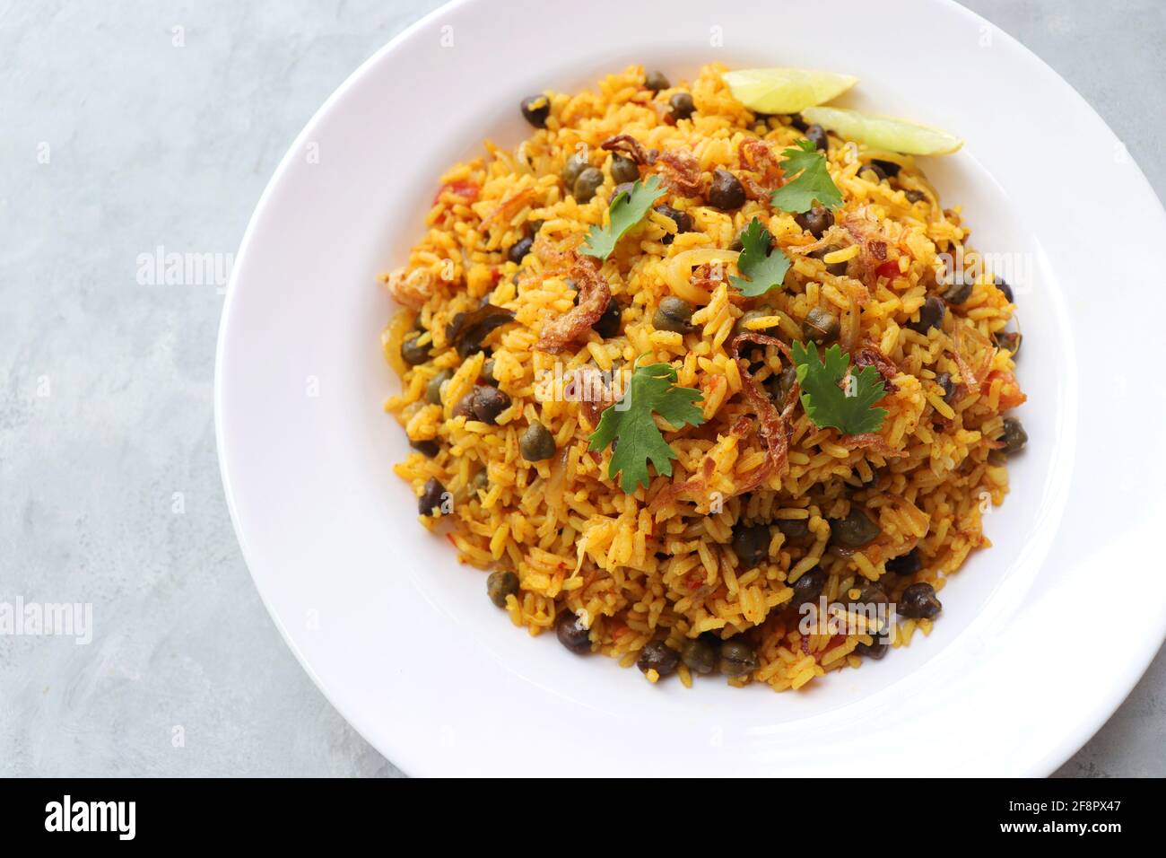 Indian cuisine - Chickpeas Biryani, chole Pulao. Garnished with fried ...