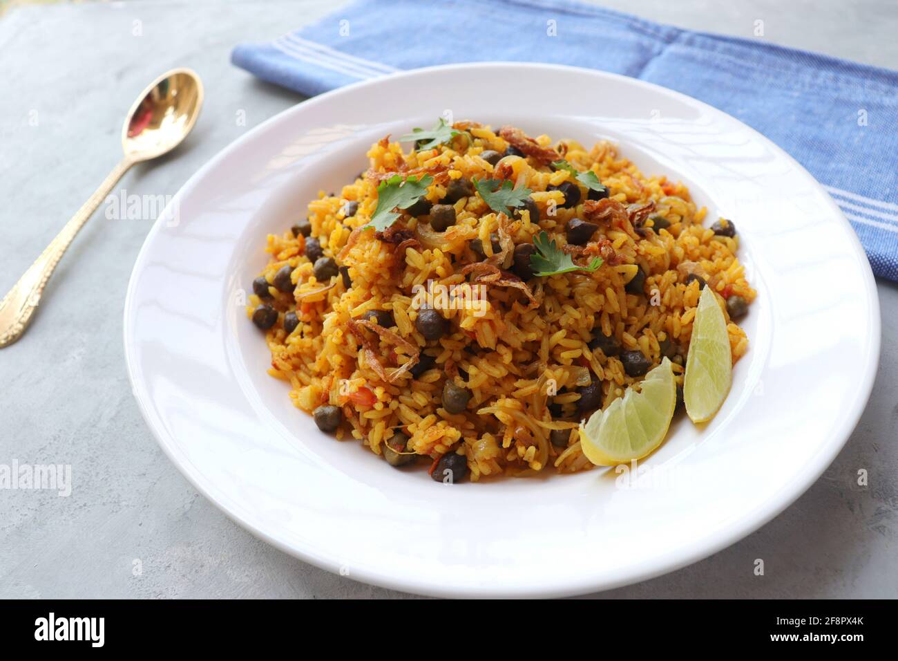 Indian cuisine - Chickpeas Biryani, chole Pulao. Garnished with fried ...