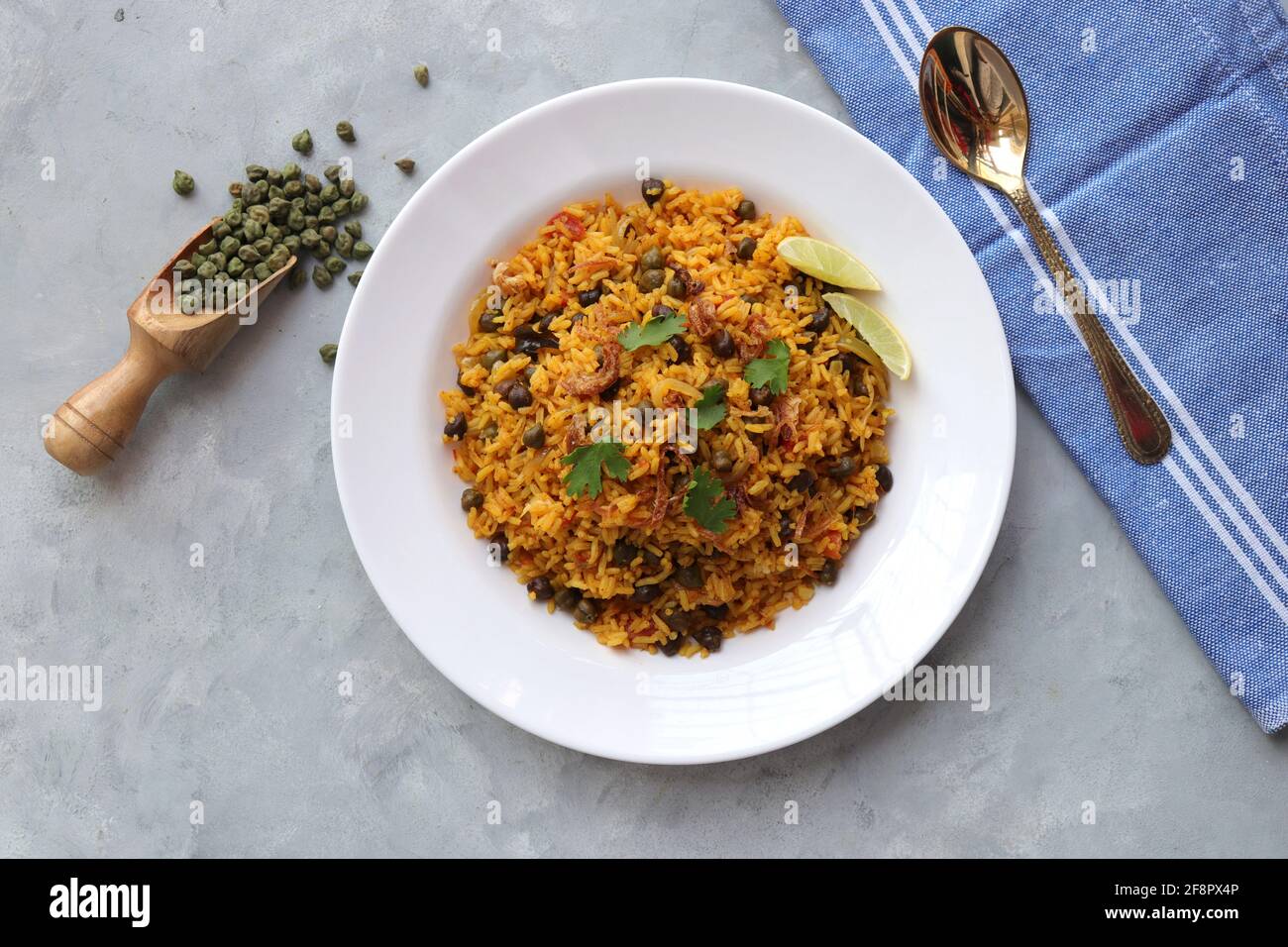 Indian cuisine - Chickpeas Biryani, chole Pulao. Garnished with fried ...