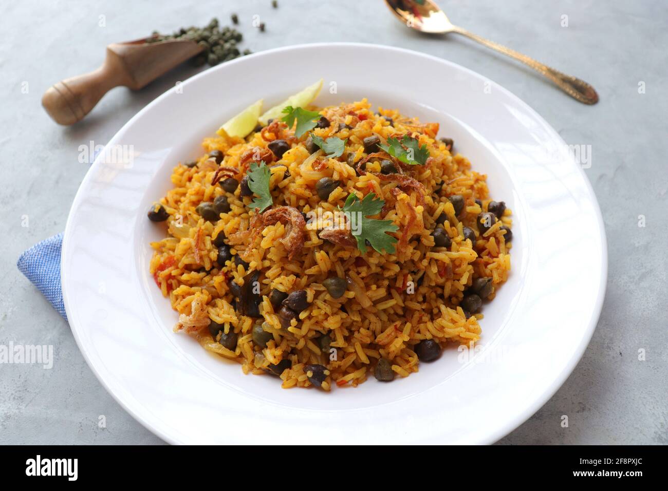 Indian cuisine - Chickpeas Biryani, chole Pulao. Garnished with fried ...
