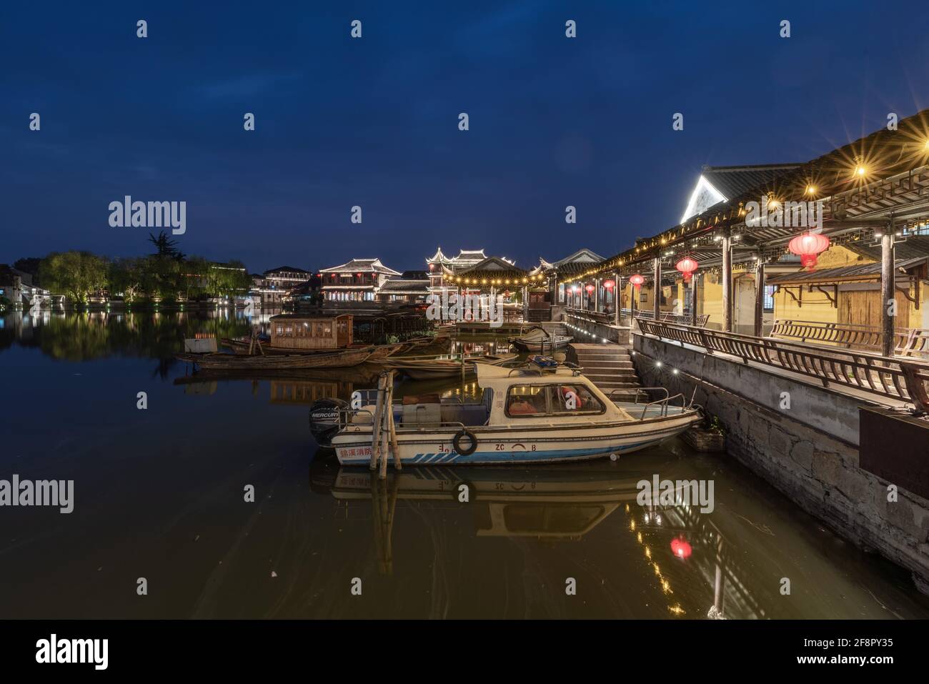 Landscapes of the ancient buildings in Jinxi at night, a historic canal ...