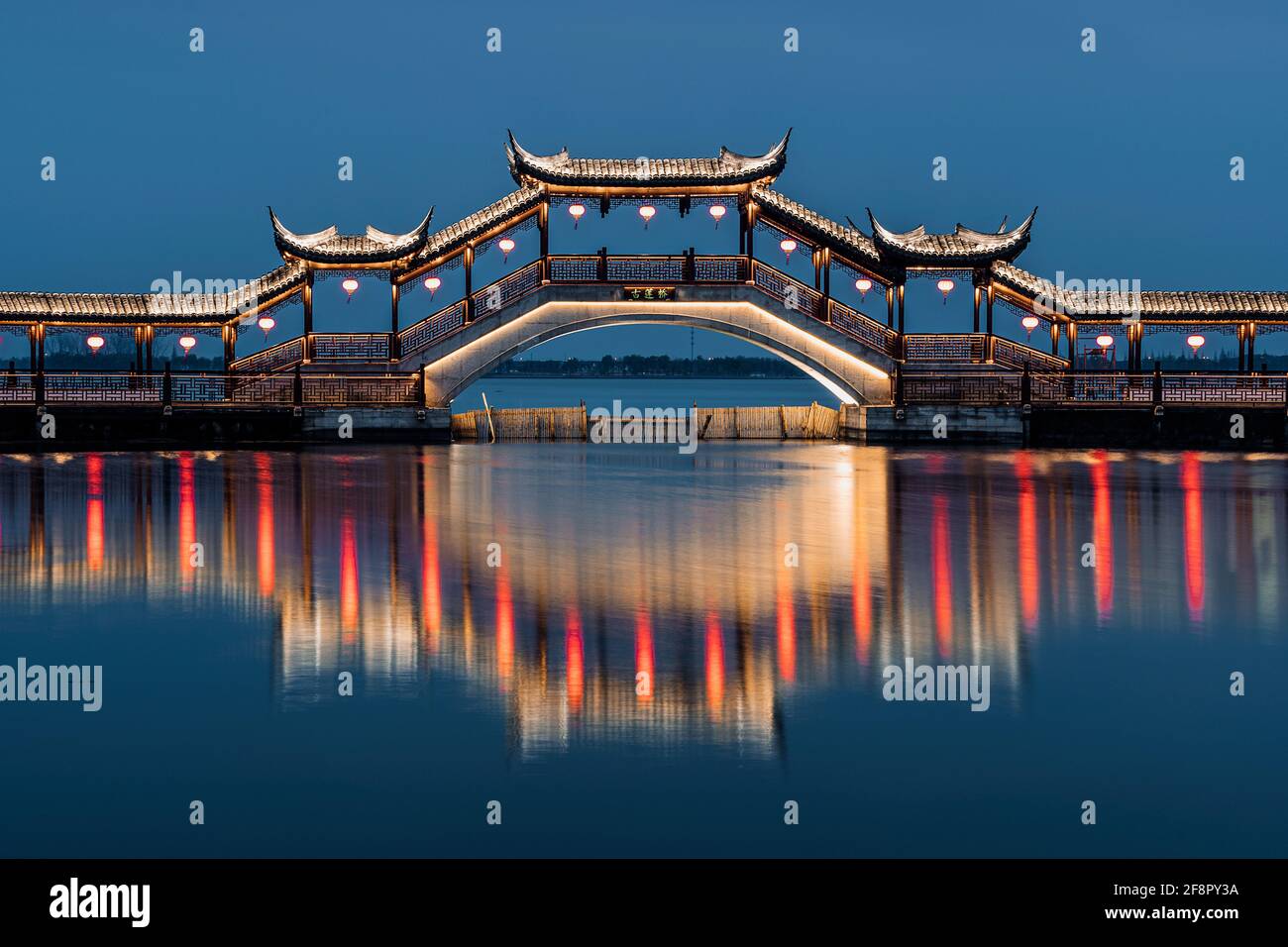 Landscapes of the ancient buildings in Jinxi at night, a historic canal ...