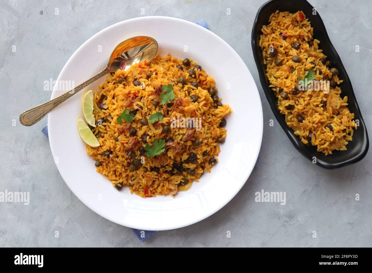 Indian cuisine - Chickpeas Biryani, chole Pulao. Garnished with fried ...