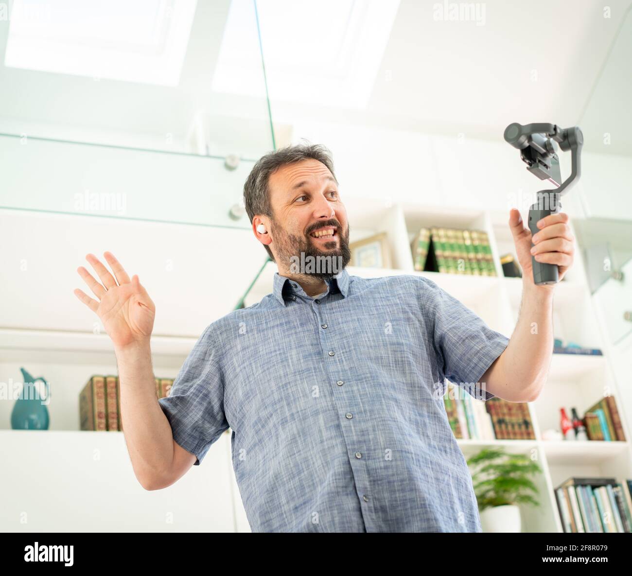 Adult male vlogger streaming online at home Stock Photo - Alamy