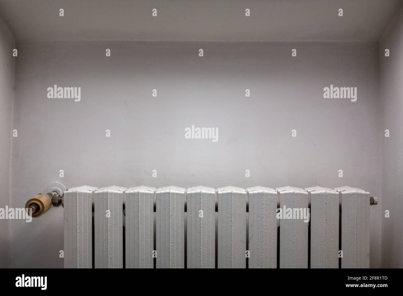 A White Heating Radiator in an Alcove on a White Wall Stock Photo - Alamy