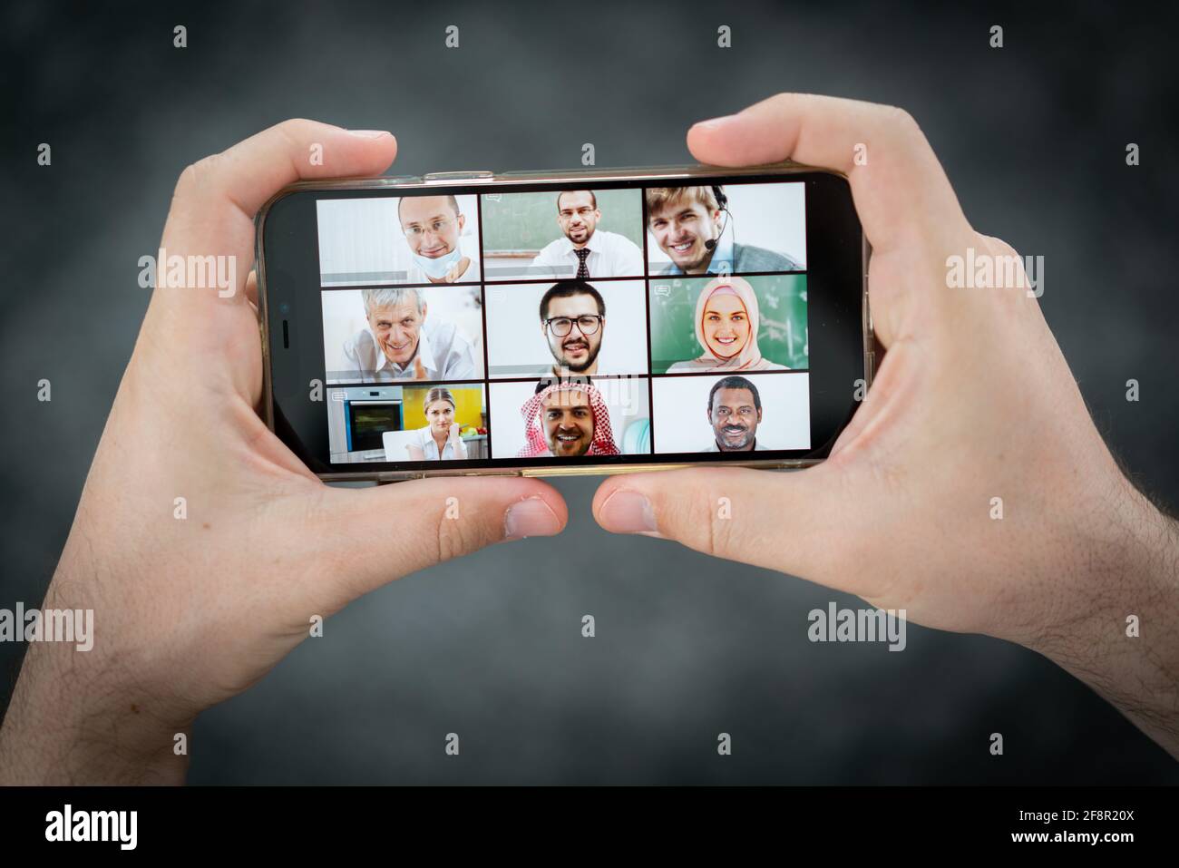 Online business conference screen in hands new normal Stock Photo - Alamy