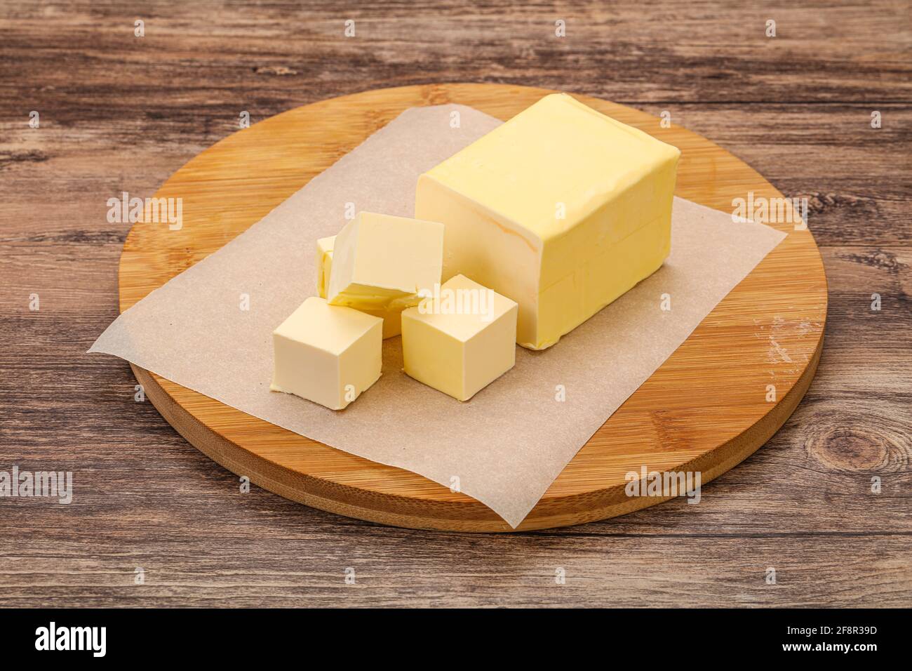 Dairy natural yellow butter piece over board Stock Photo - Alamy
