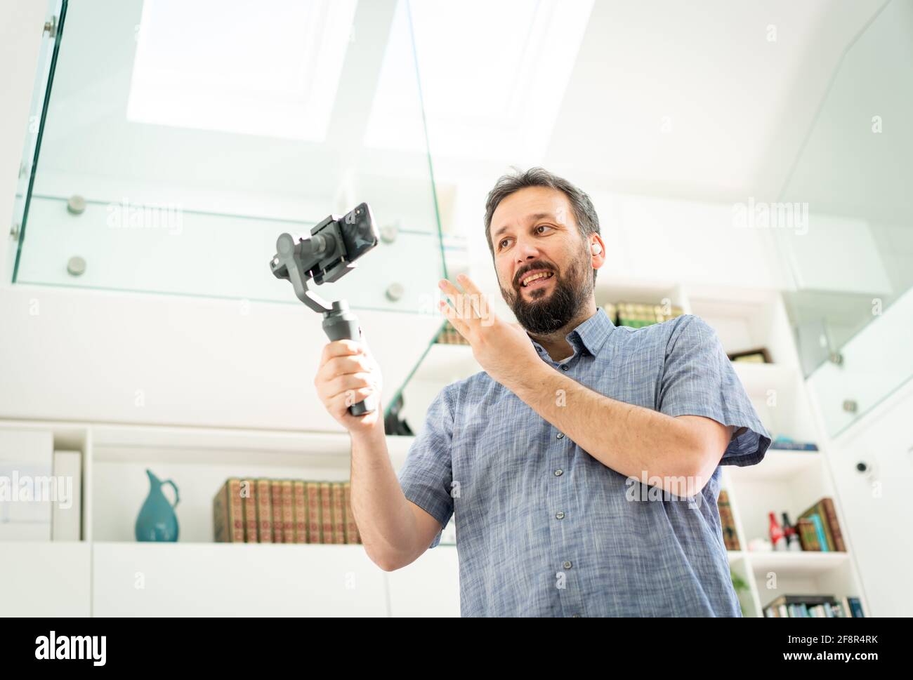 Adult male vlogger streaming online at home Stock Photo - Alamy