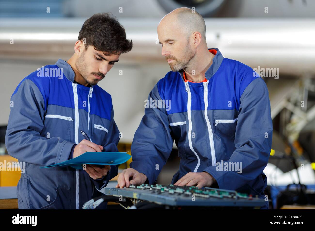 aviation assembling team at work Stock Photo - Alamy