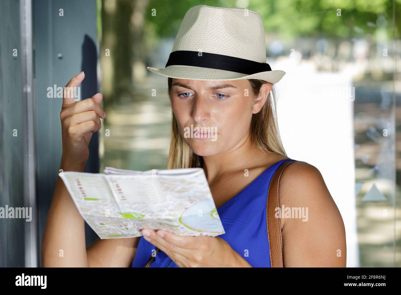 a woman map checking map Stock Photo - Alamy