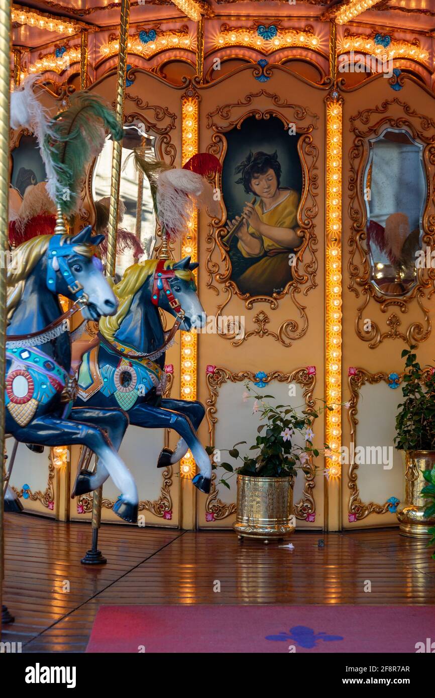Closeup of Two Wooden Carousel Horses With Feathers Racing Stock Photo ...
